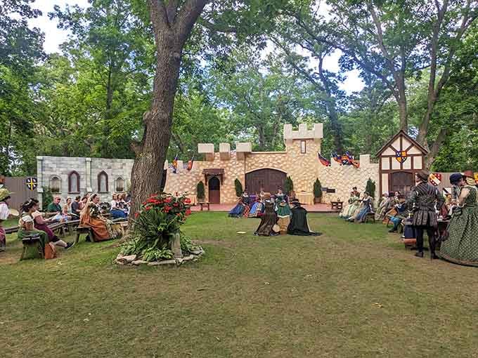 The castle backdrop sets the stage where Queen Elizabeth's court gathers for royal entertainment and merriment.