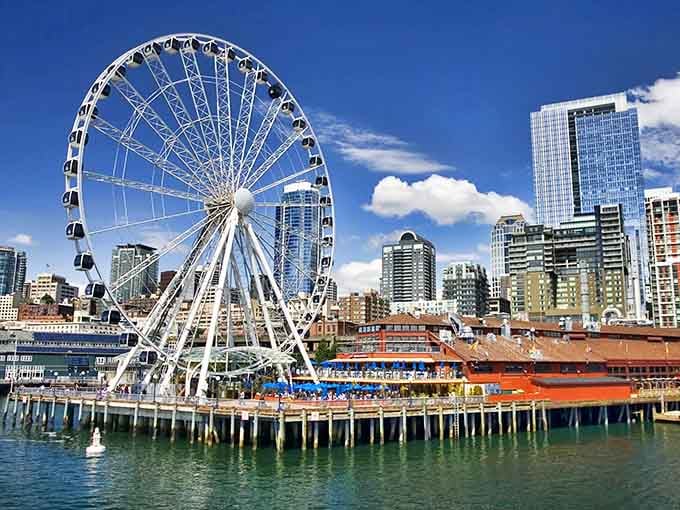 The Seattle Great Wheel towers over Pier 57 like a giant promise of adventure with a side of clam chowder.