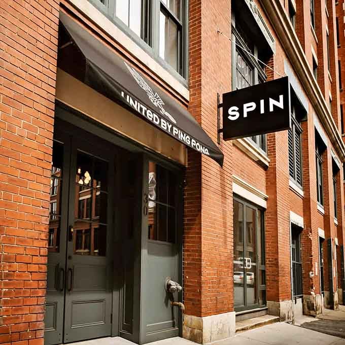 SPIN Boston's unassuming entrance hides one of the city's most entertaining dining experiences behind those green doors.