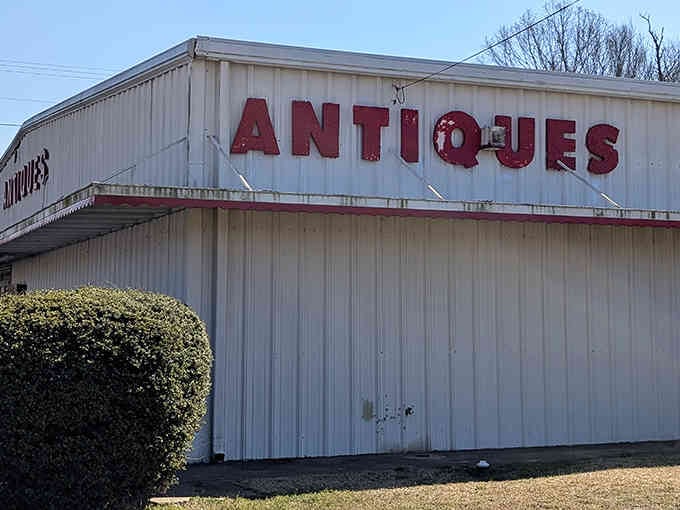 That unassuming warehouse exterior is hiding more treasures than a pirate's secret cove in the Caribbean.