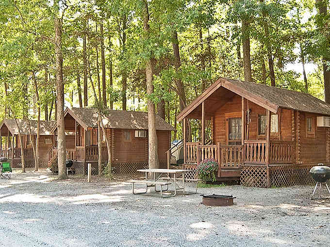 These cabins prove that "roughing it" can include screened porches and actual stairs to your front door.