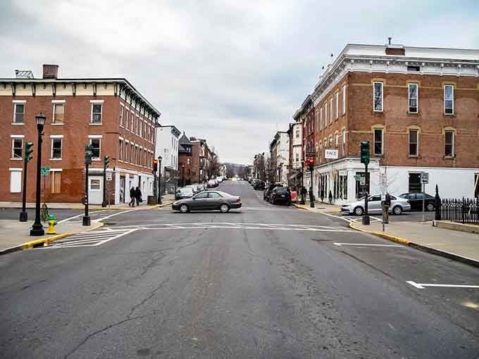 Warren Street stretches before you like a perfectly preserved time capsule with actual parking spots.