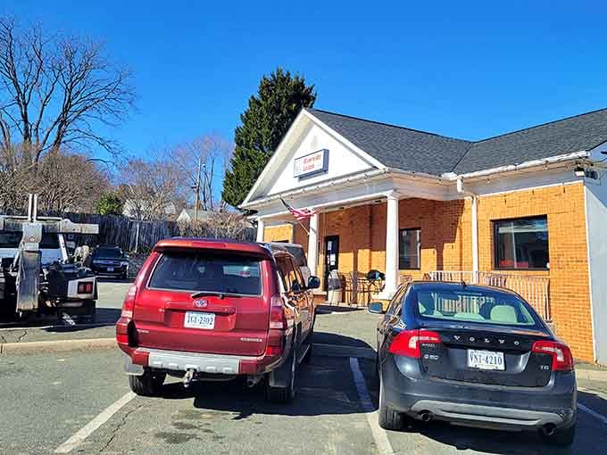 That classic brick facade with white columns isn't just charming architecture&mdash;it's your gateway to legendary carrot cake and comfort food heaven.