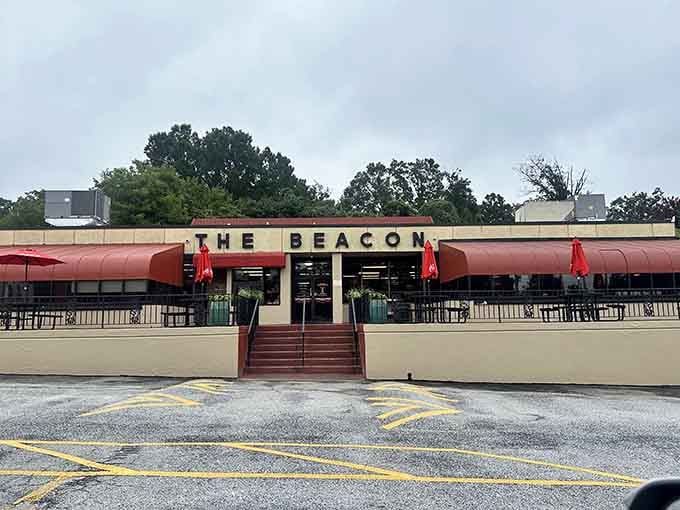 Those red canopies stretch out like welcoming arms, promising the kind of meal that'll make you loosen your belt.