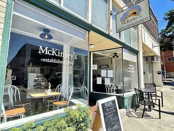 The green awning and outdoor seating invite you to slow down and remember what lunch should actually feel like.