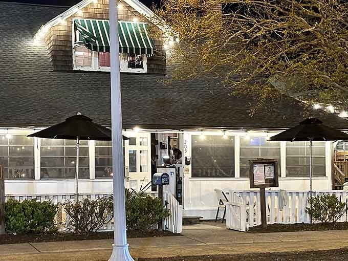 The white picket fence and cozy porch practically beg you to come in and stay awhile.