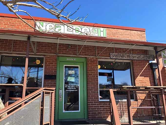 That cheerful green signage against red brick is your beacon to biscuit bliss in downtown Carrboro.