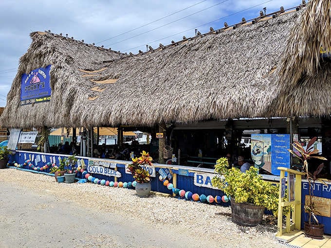 That thatched roof and those colorful buoys signal you've arrived at waterfront paradise where flip-flops are formal wear.