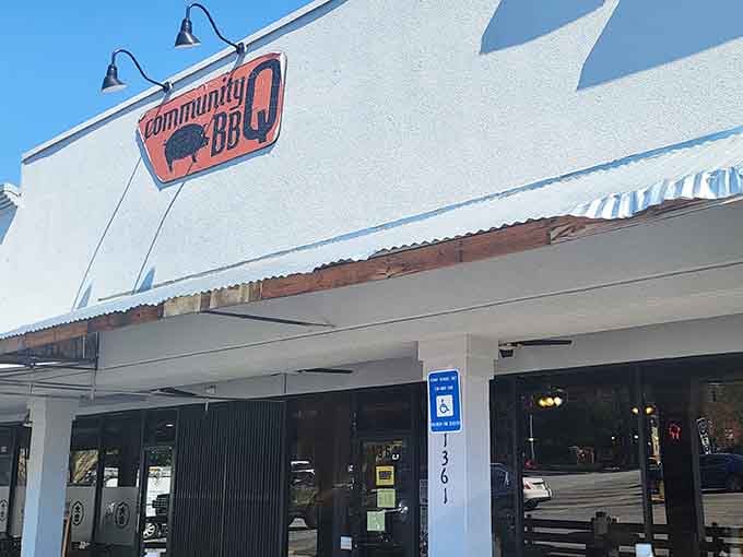 Barbecue dreams are made of this: Community BBQ's welcoming storefront promises smoky, slow-cooked perfection waiting inside.
