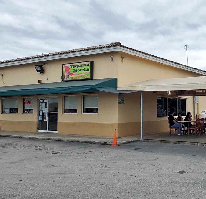 That yellow and green sign beckoning from a gas station canopy is your treasure map to taco paradise in Florida City.
