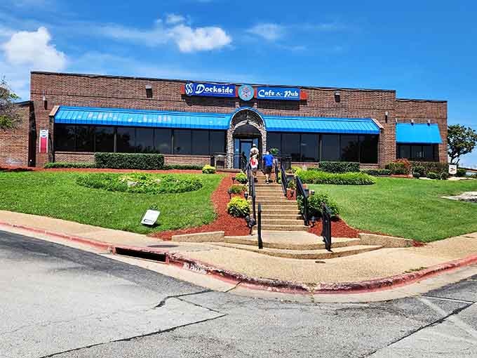 That blue awning isn't just decoration &ndash; it's a beacon calling hungry souls to burger salvation by the water.