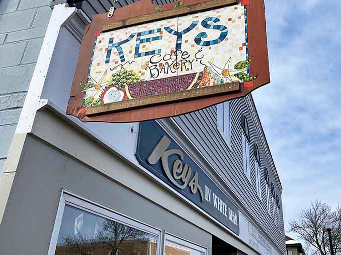That cheerful mosaic sign promises breakfast happiness, and trust me, it delivers on every delicious word.