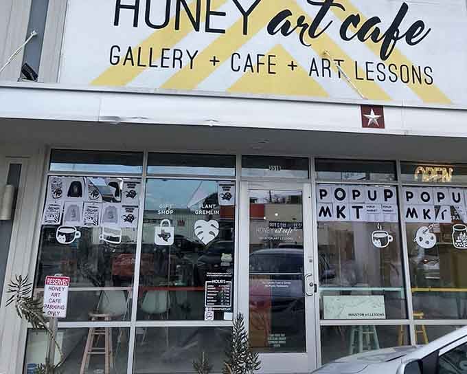 The cheerful yellow awning promises creativity inside, where gallery meets cafe in perfect harmony.