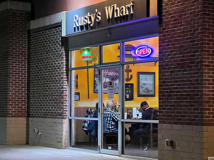 That cheerful yellow glow through the windows isn't just good lighting, it's a beacon of fried seafood happiness calling you home.