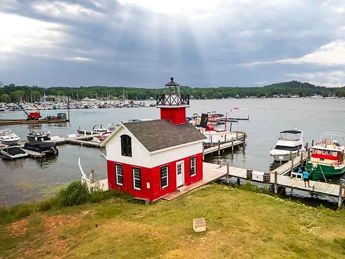 That cheerful red lighthouse on the marina isn't just photogenic, it's basically Saugatuck's way of saying "welcome home."