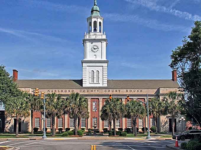 The Marlboro County Courthouse stands proud with its soaring clock tower, proving that government buildings don't have to be boring concrete boxes.