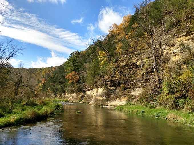 Those limestone bluffs rising above the Whitewater River look like nature's own cathedral walls.