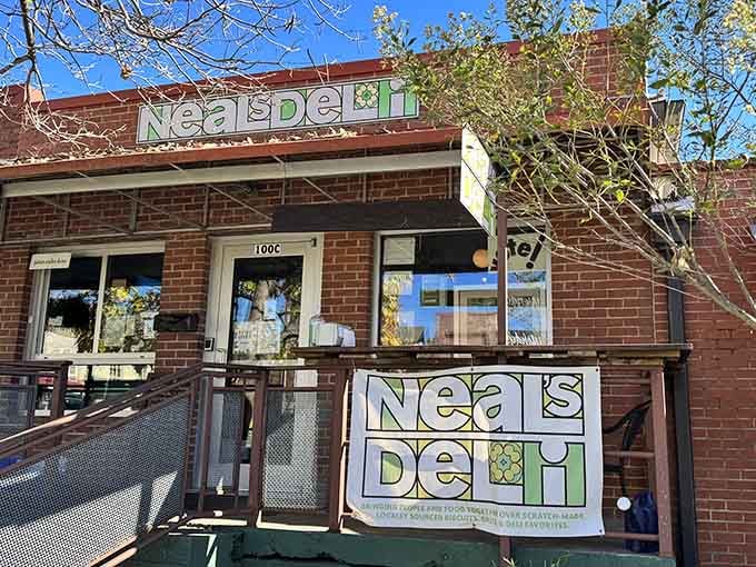 That cheerful green signage against red brick is your beacon to biscuit bliss in downtown Carrboro.
