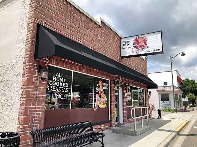 That brick facade and cheerful awning signal you've arrived at breakfast paradise in New Smyrna Beach.