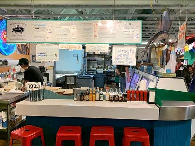 Those bright red stools are your front-row seats to the freshest seafood show in Ann Arbor.