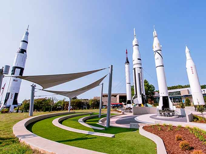 The rocket garden showcases America's greatest hits in space exploration, standing tall like a very patriotic, very pointy forest.