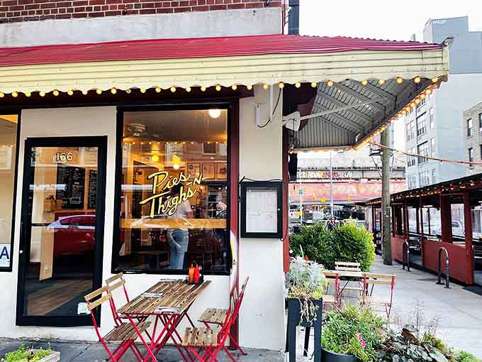 That striped awning and golden script lettering whisper Southern hospitality louder than any neon sign ever could.