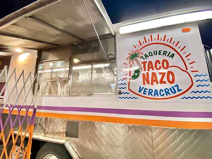 That cheerful Veracruz sign glowing under the night sky promises authentic flavors worth every single calorie.