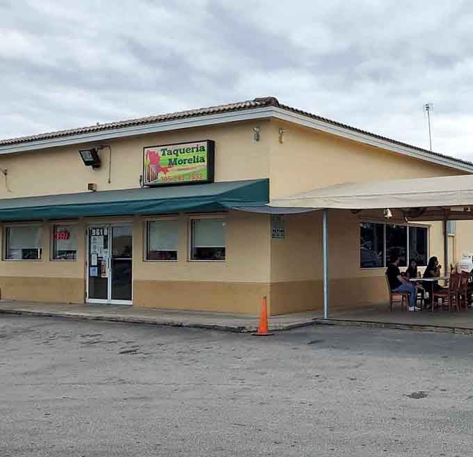 That yellow and green sign beckoning from a gas station canopy is your treasure map to taco paradise in Florida City.
