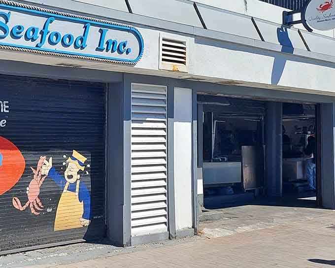 That cheerful mural outside promises seafood happiness, and trust me, this place delivers on every painted promise.
