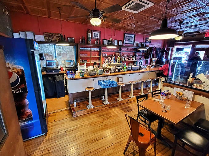 That tin ceiling has seen more history than most museums, now watching over plates of perfectly smoked barbecue instead.