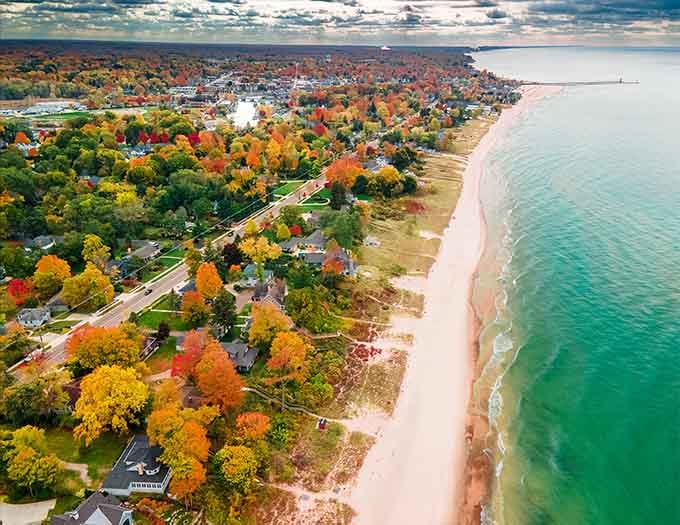 Fall foliage meets pristine shoreline in a view that'll make coastal snobs rethink their ocean superiority complex entirely.