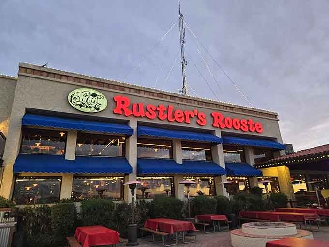 That blue awning beckons like a beacon of beef and Western dreams perched high above the valley.