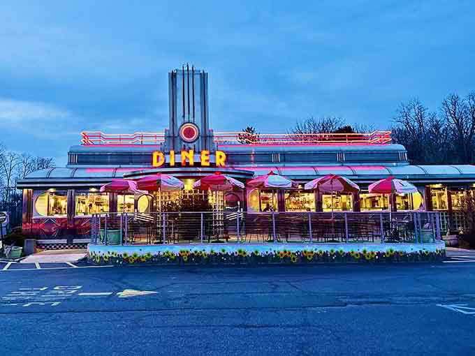 That Art Deco tower and neon glow make this diner look like a spaceship that landed in 1952 and decided to stay.