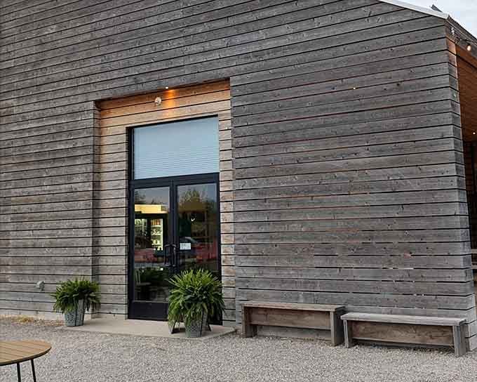 That modern barn aesthetic hits different when you know there's actual farming happening behind those walls.