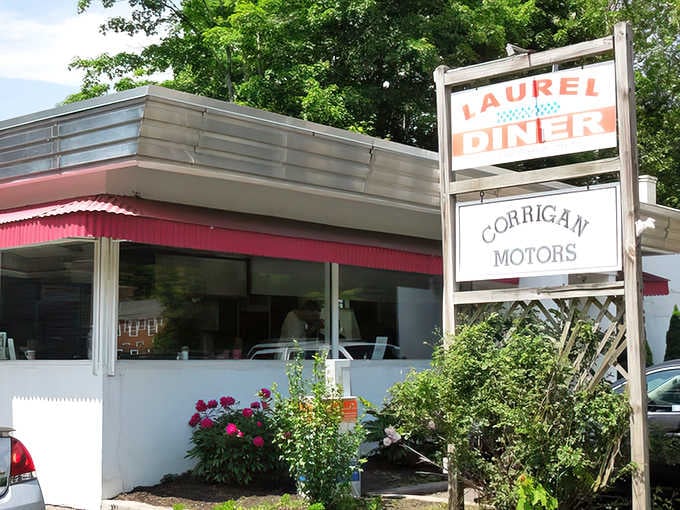 That classic diner sign beckons like a lighthouse for hungry souls seeking real food made by real people.