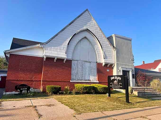 The Iron Island Museum stands proud on Lovejoy Street, its Gothic arched entrance hinting at the stories within.