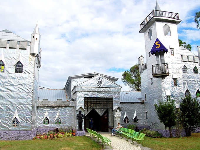 The castle's entrance beckons like a medieval gateway, complete with towers and turrets that would make any knight feel right at home.