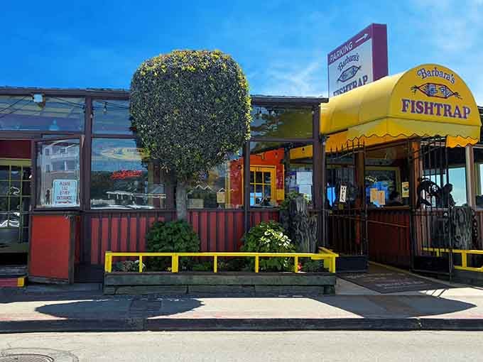The cheerful yellow awning beckons hungry travelers like a lighthouse guiding ships safely to delicious harbor.