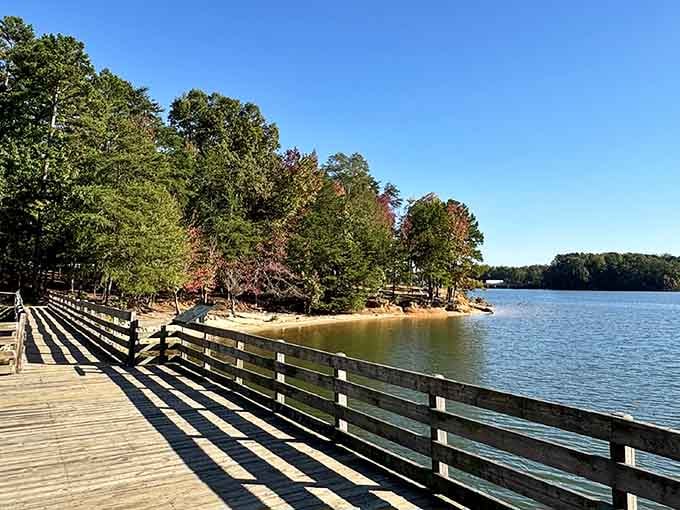 That wooden pier stretching into fall colors isn't just Instagram bait, it's your gateway to lake life perfection.