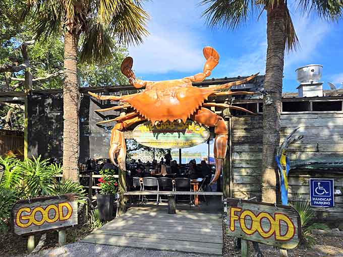 That giant crab isn't just decoration, it's a promise of the delicious chaos waiting inside those weathered walls.