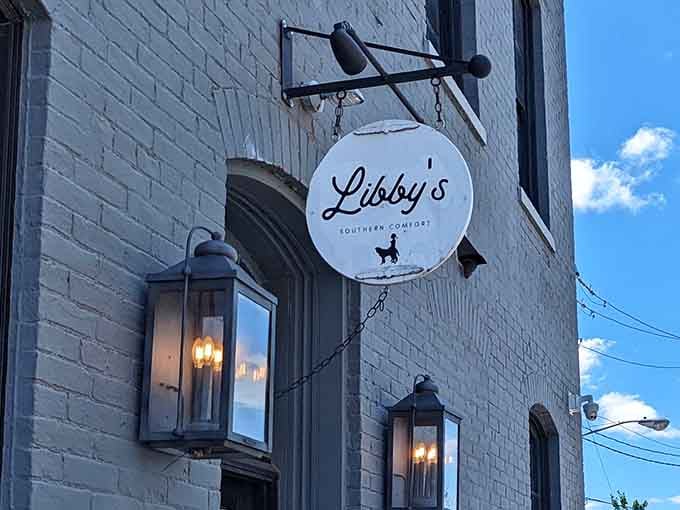 That charming round sign beckons like a lighthouse guiding hungry souls to Southern comfort food salvation.