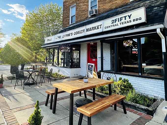 That white brick exterior with outdoor seating practically screams "authentic barbecue lives here, come hungry and leave happy."