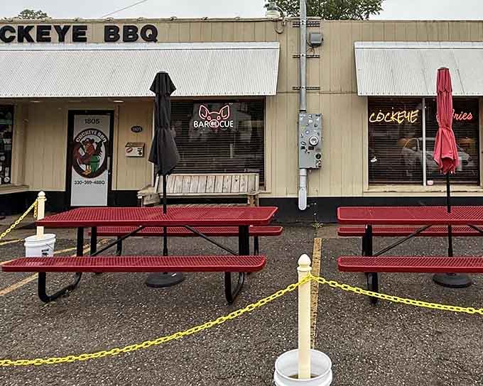 Red picnic tables signal serious barbecue ahead, where outdoor dining meets smoke-filled dreams in Warren's hidden gem.