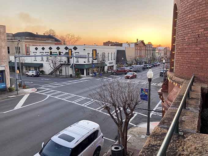 That sunset glow transforms ordinary storefronts into something magical, reminding us why main streets matter more than malls.