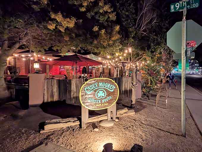 That charming wooden sign glowing under string lights is your invitation to step back in time tonight.