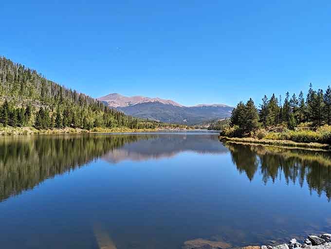 Mirror-perfect reflections and mountain peaks that look like they've been Photoshopped, except this is gloriously, impossibly real.