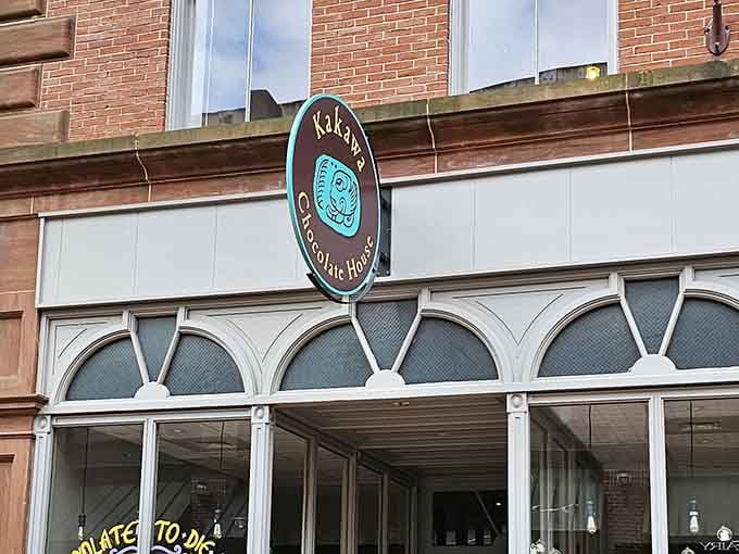 That distinctive sign above the entrance promises something far more interesting than your average chocolate shop experience.