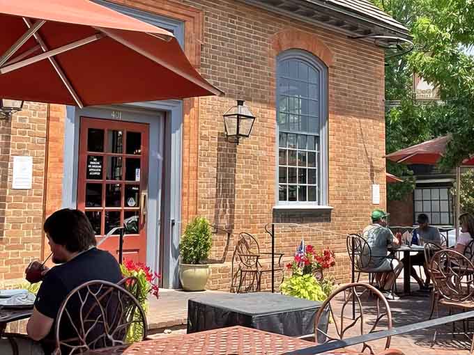 The brick facade whispers stories of financial transactions past while the patio promises much better deposits: craft beer and good company.