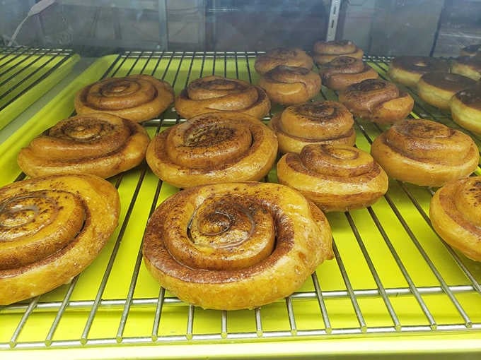 Fresh cinnamon rolls cooling on the rack, still glistening, basically begging you to abandon your diet plans.