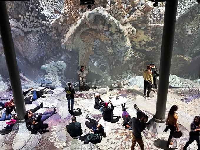 Layered projections create depth that tricks your brain, making flat walls feel like infinite dimensional doorways.